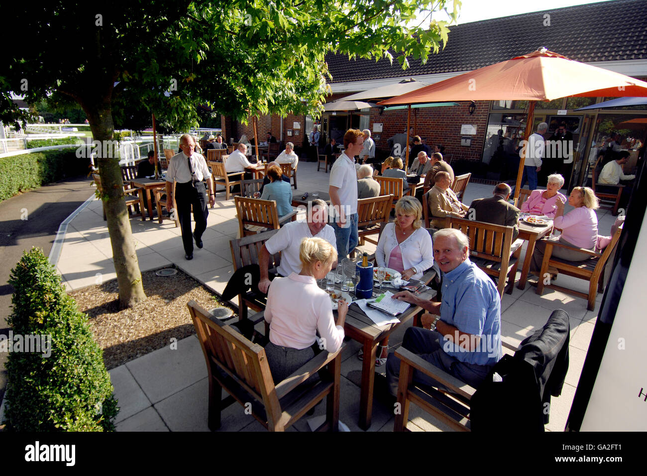 Guests enjoy food and drink at the Food Court at the Kempton Park ...