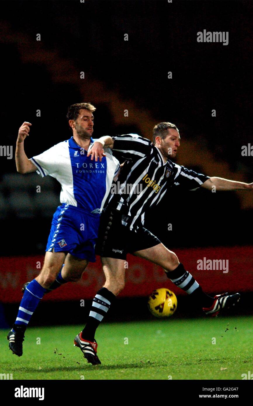 Oldham Athletic's Stuart Balmer battles for possession of the ball with ...