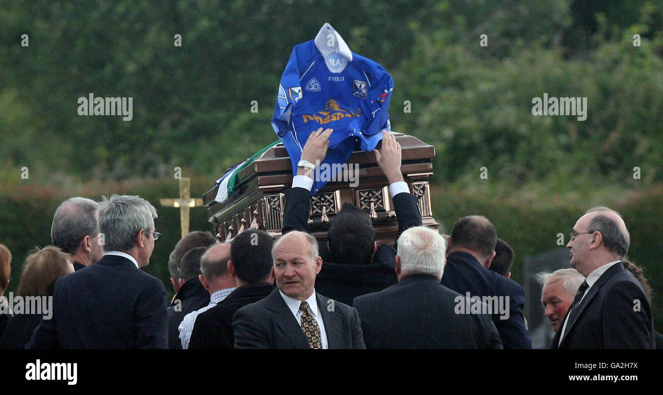 A Cavan GAA shirt is thrown onto the coffin of Thomas Reilly, the man ...