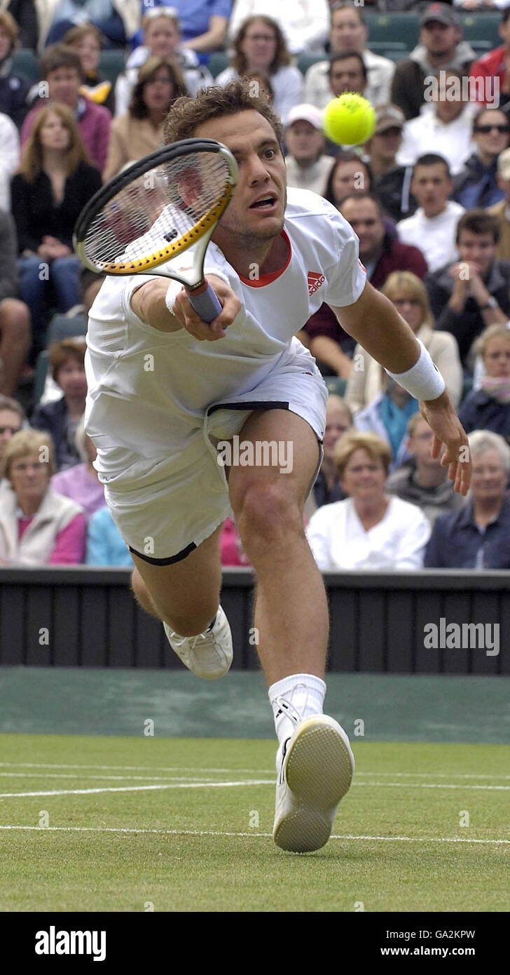France's Paul-Henri Mathieu in action against USA's Andy Roddick during ...