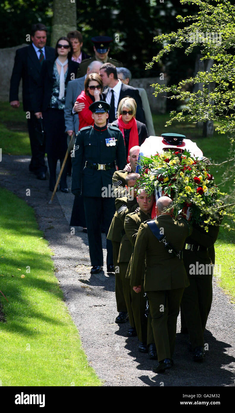 Corporal Will Rigby (middle) accompanied by family members, follows the ...