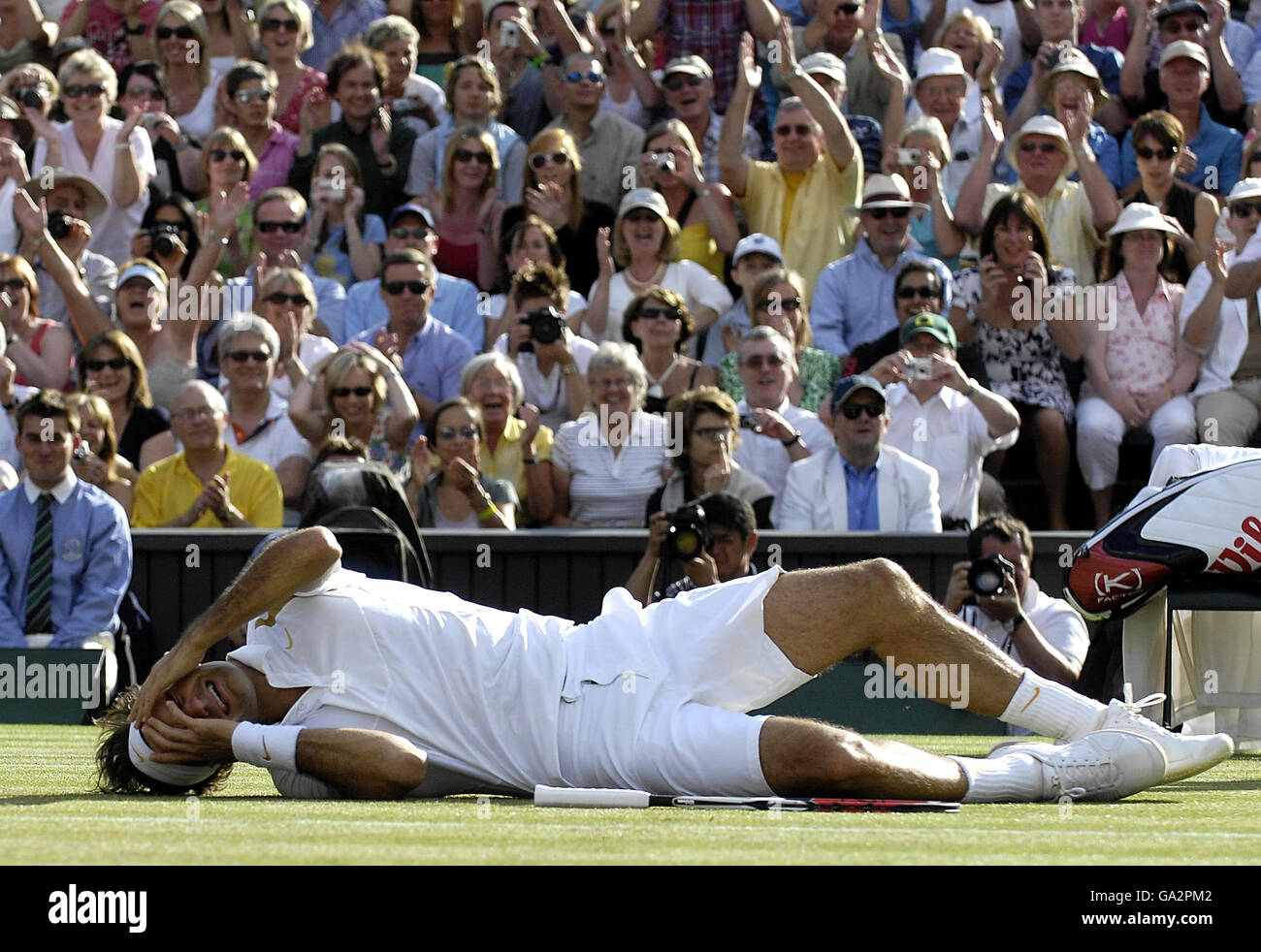 Switzerland's Roger Federer celebrates his fifth successive Wimbledon ...