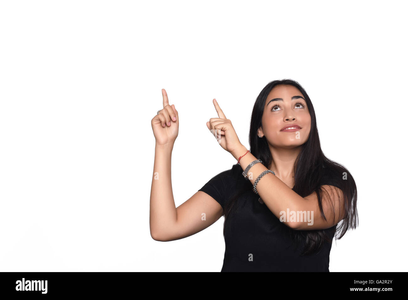 Young beautiful woman pointing at white background Stock Photo - Alamy
