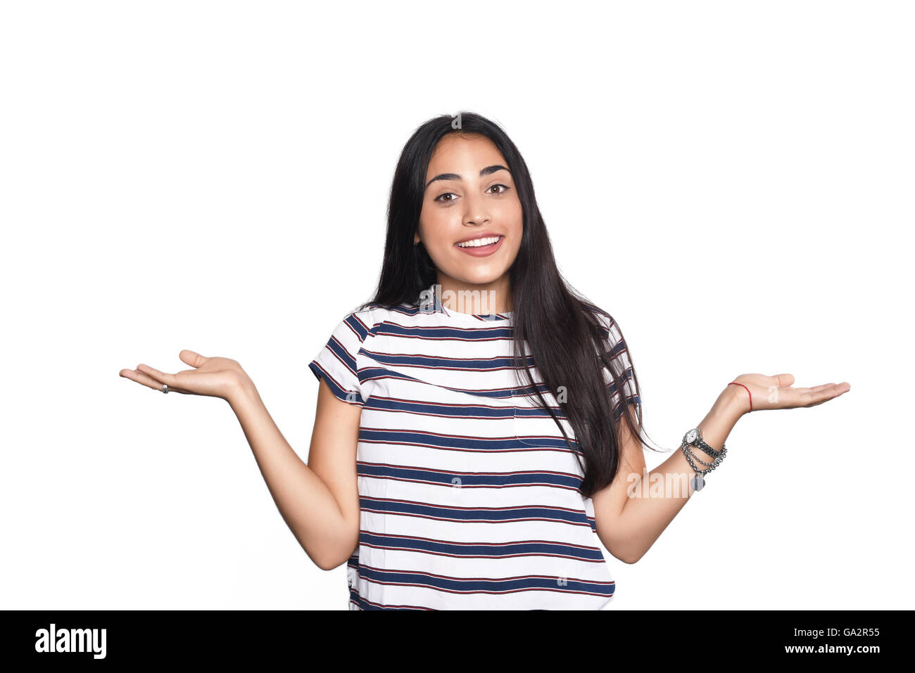 Indecisive young woman with arms open. Isolated white background Stock ...