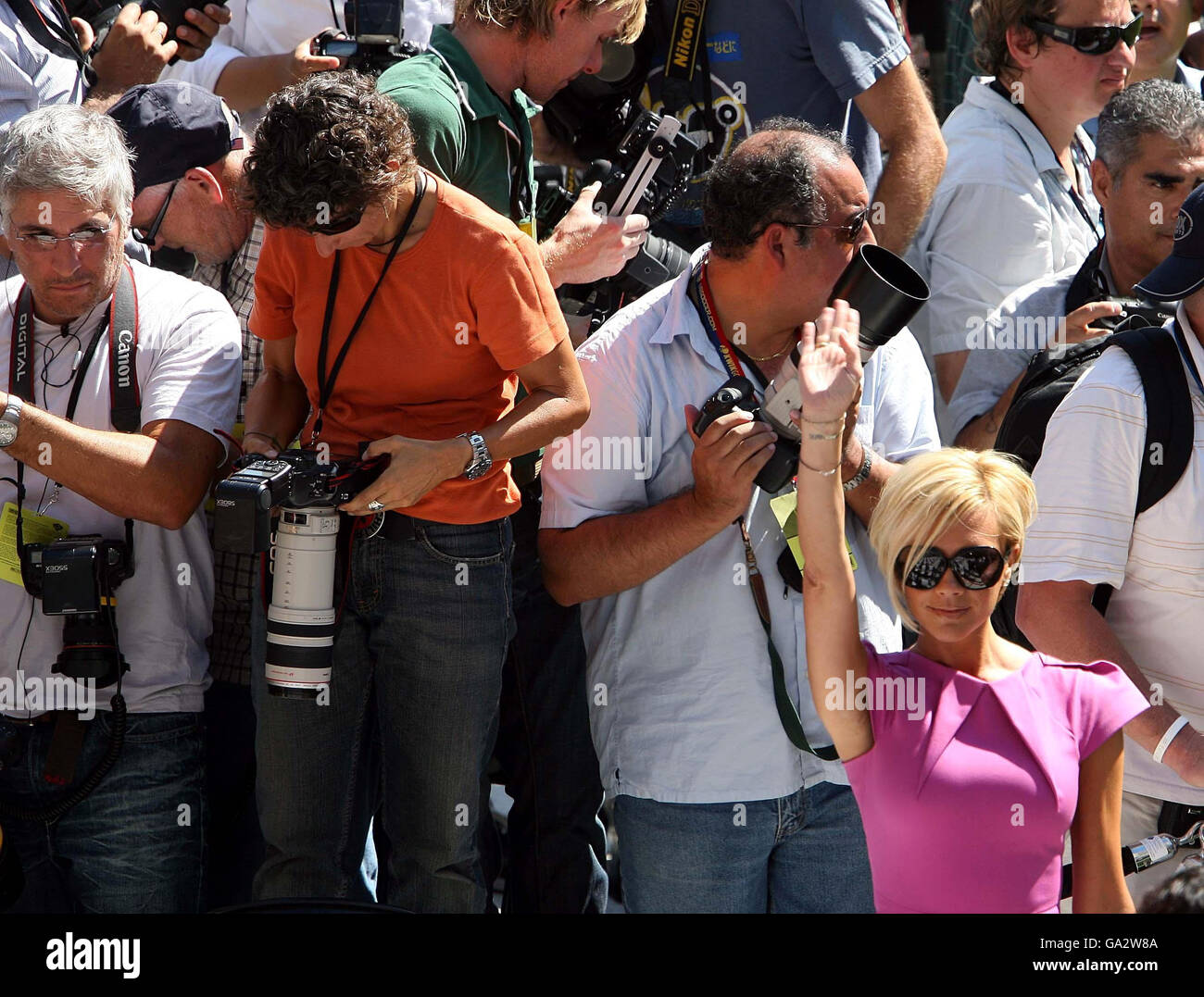 Victoria Beckham waves to the fans before her husband, David Beckham's ...