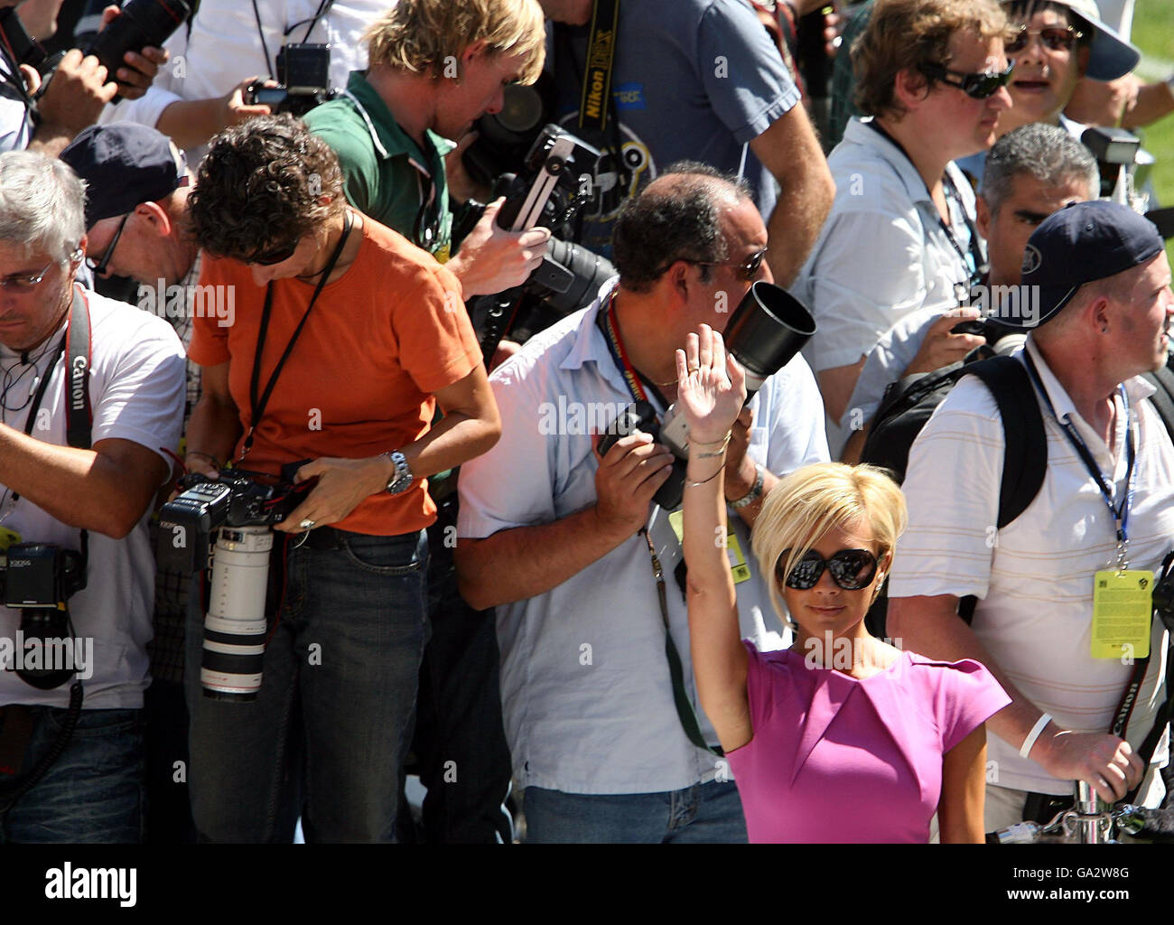 Victoria Beckham waves to the fans before her husband, David Beckham's ...
