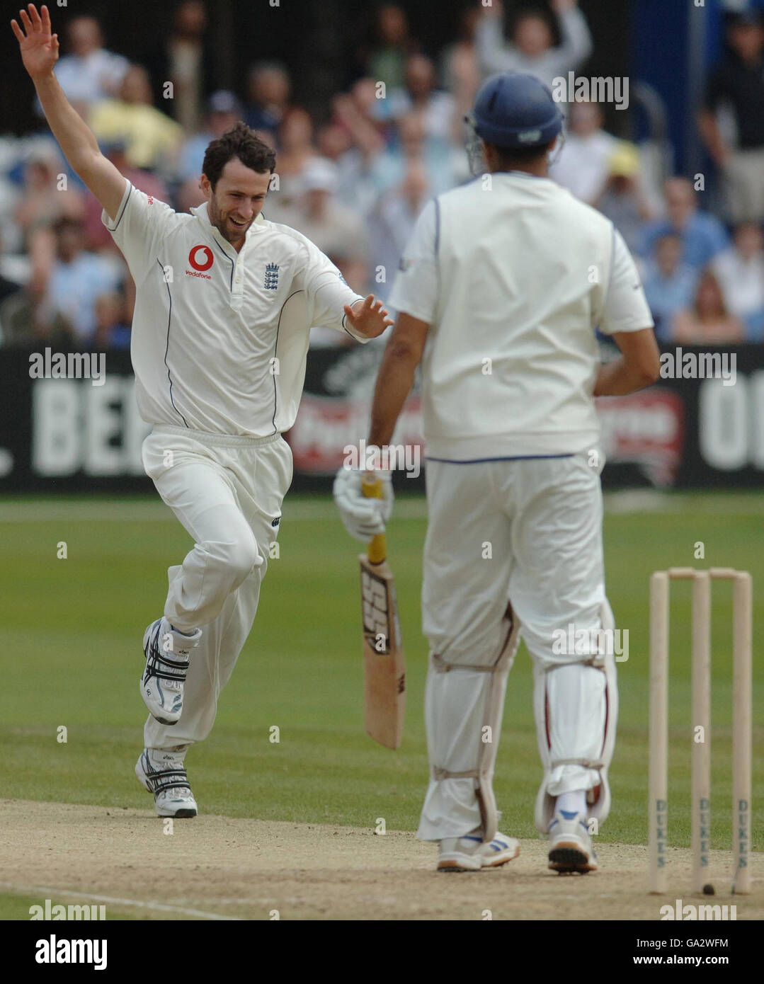 England's Graham Onions celebrates bowling V V S Laxman during the Tour ...