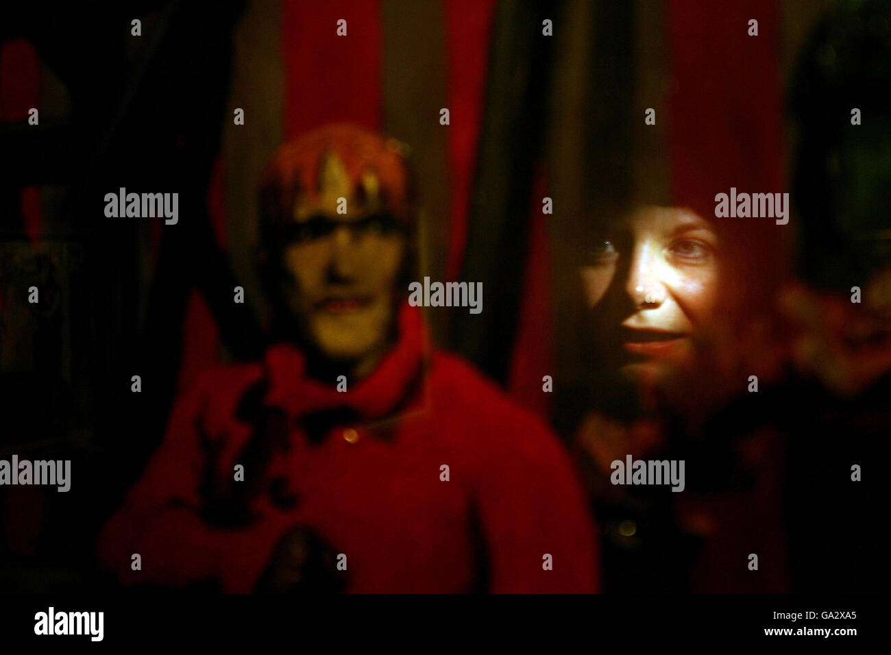 Dr. Roisin Kennedy is reflected in 'Circus Dwarf' at an exhibition ...