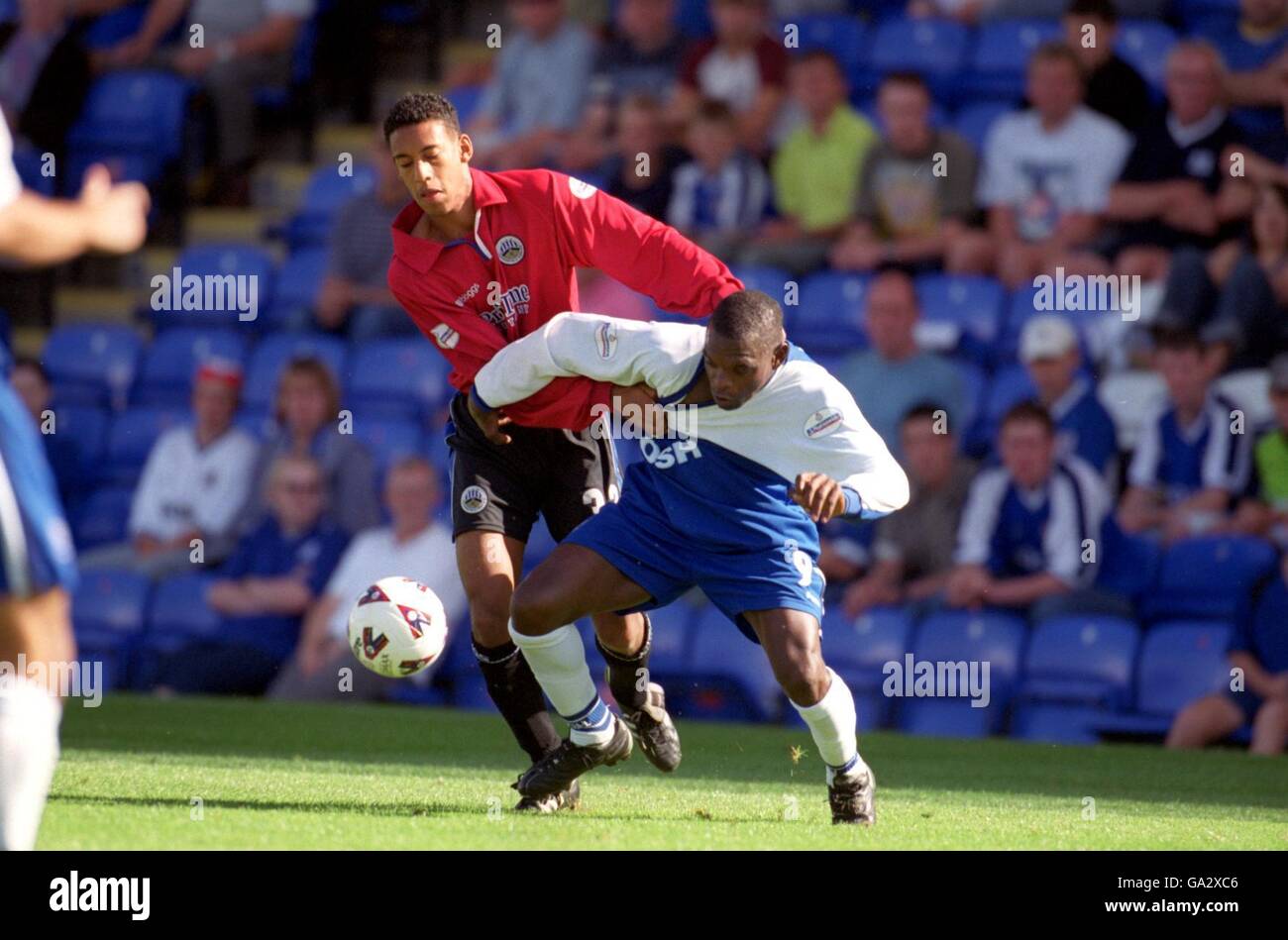 Peterborough uniteds andy clarke battles with huddersfield towns mattis ...