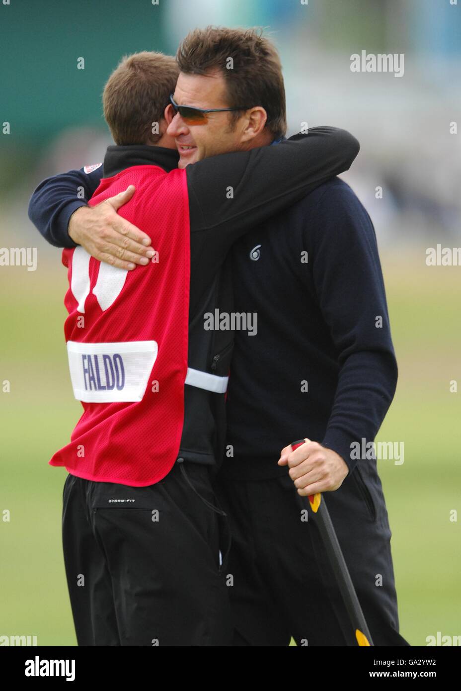 Nick Faldo hugs his son and caddie during The Open Championship at the ...