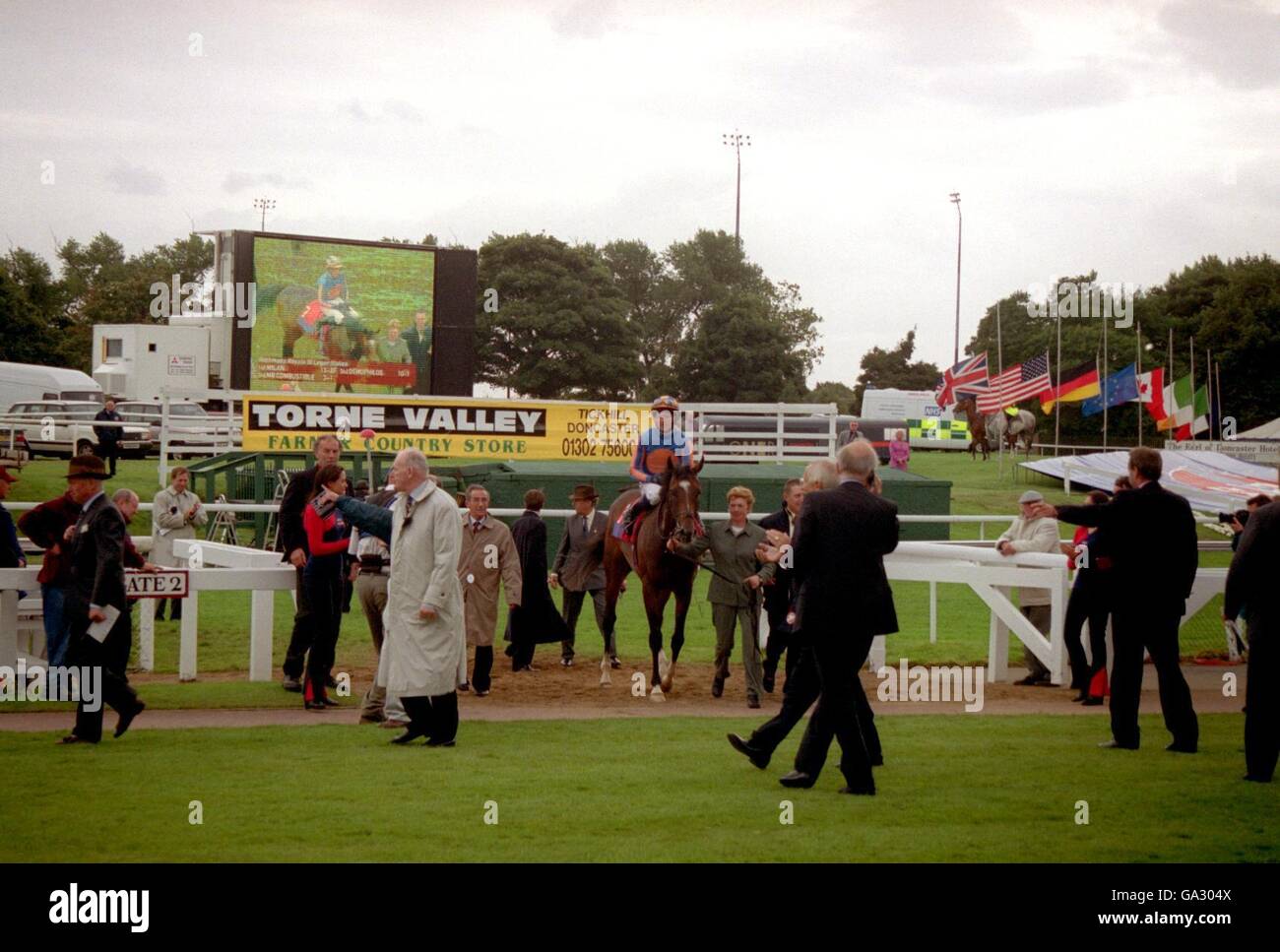 Mick Kinane on the winning horse Milan is lead from the track after ...