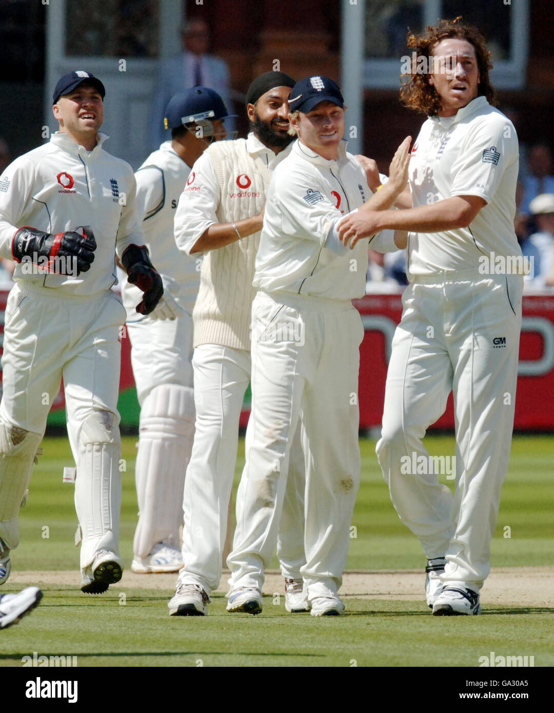 England's Ryan Sidebottom (right) celebrates taking the wicket of India ...