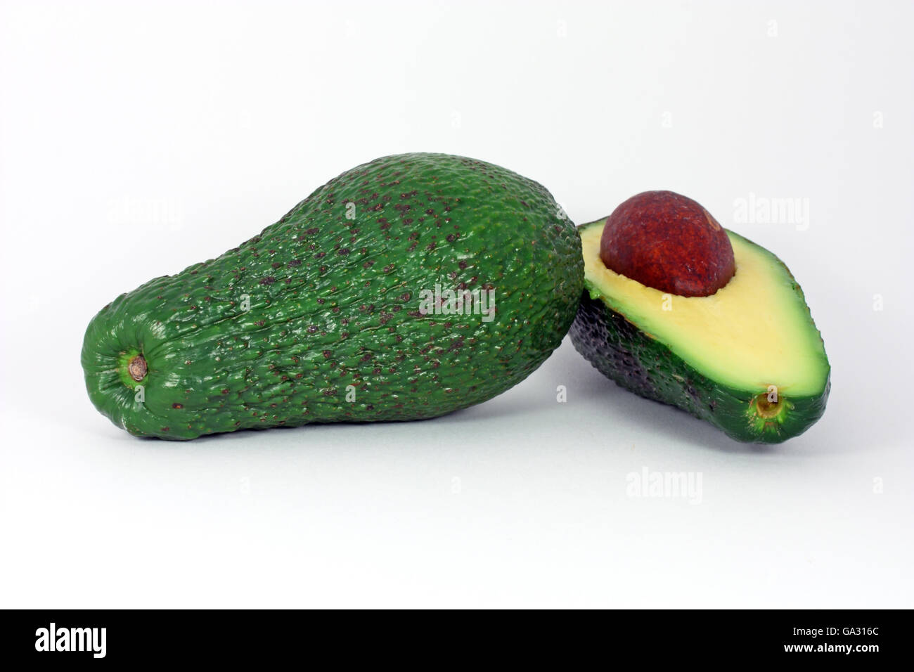 Single avocado fruit isolated on white background Stock Photo - Alamy