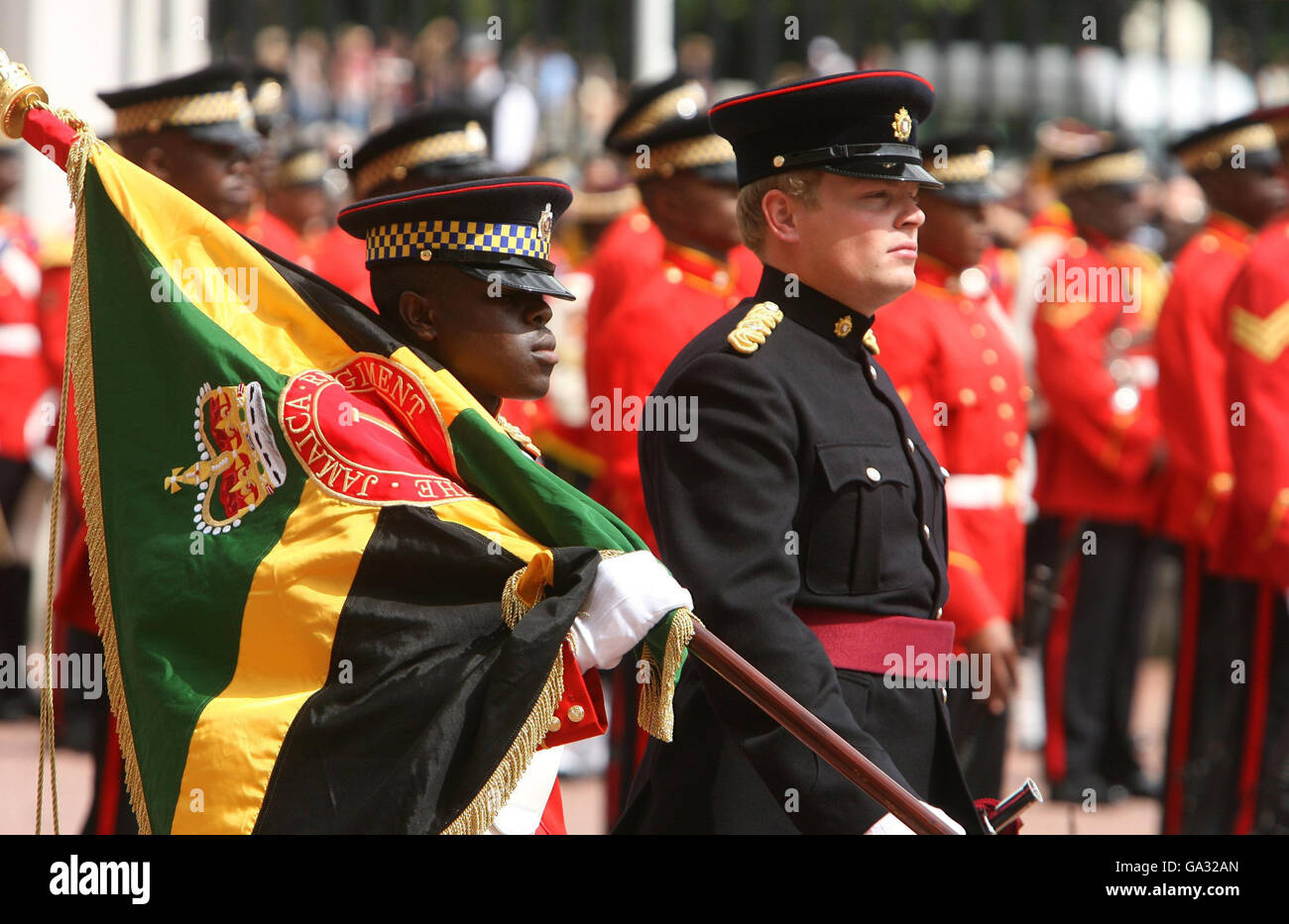 A soldier from the 1st Battalion Jamaican Regiment (left) is accompanid ...