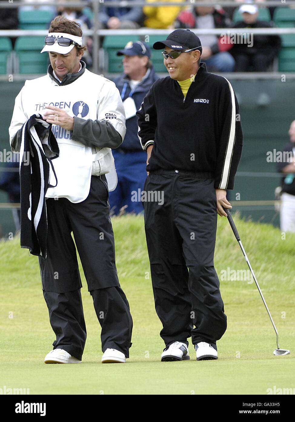 Japan's Toru Taniguchi and his caddy during The Open Championship at ...