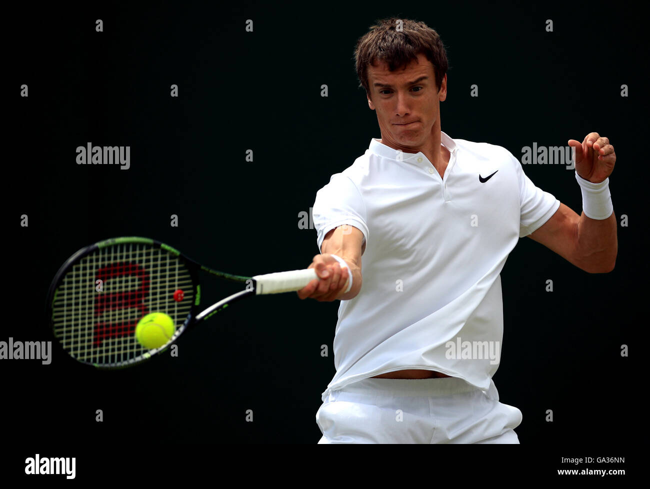 Andrey Kuznetsov returns to Kei Nishikori on day six of the Wimbledon ...