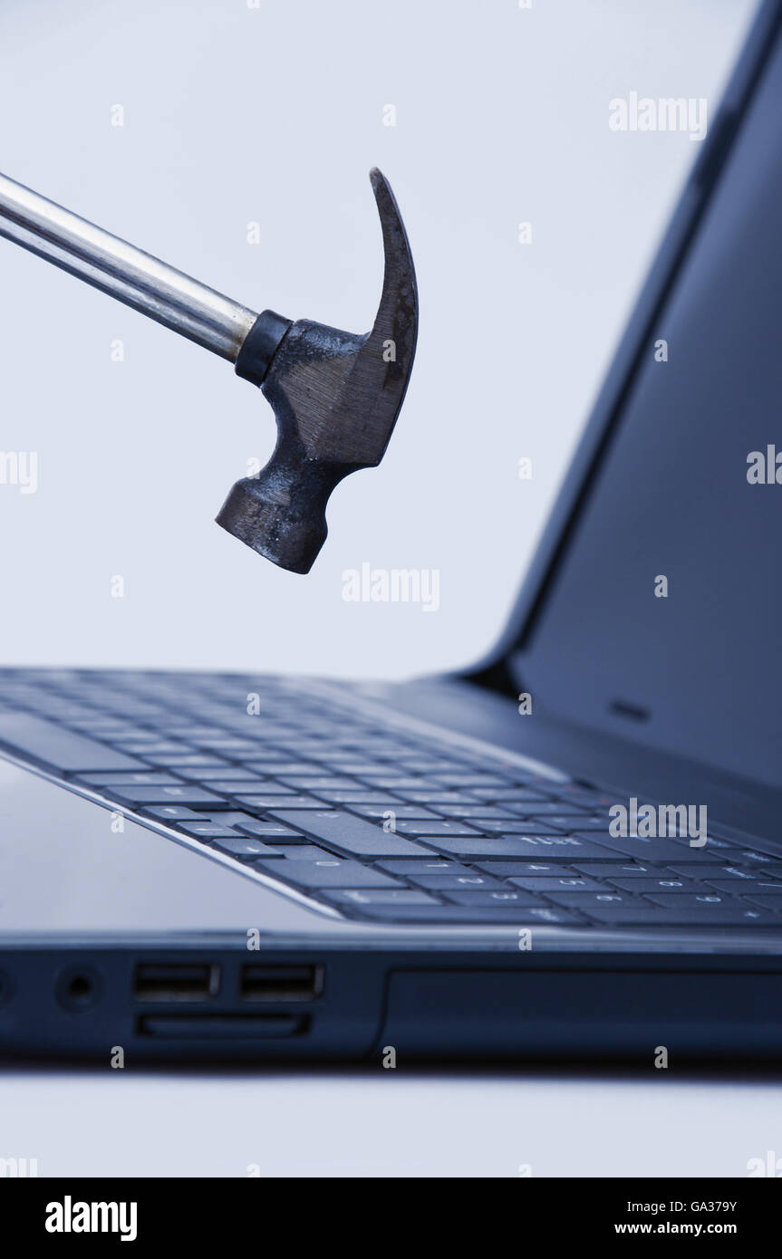 Hammer and laptop hi-res stock photography and images - Alamy