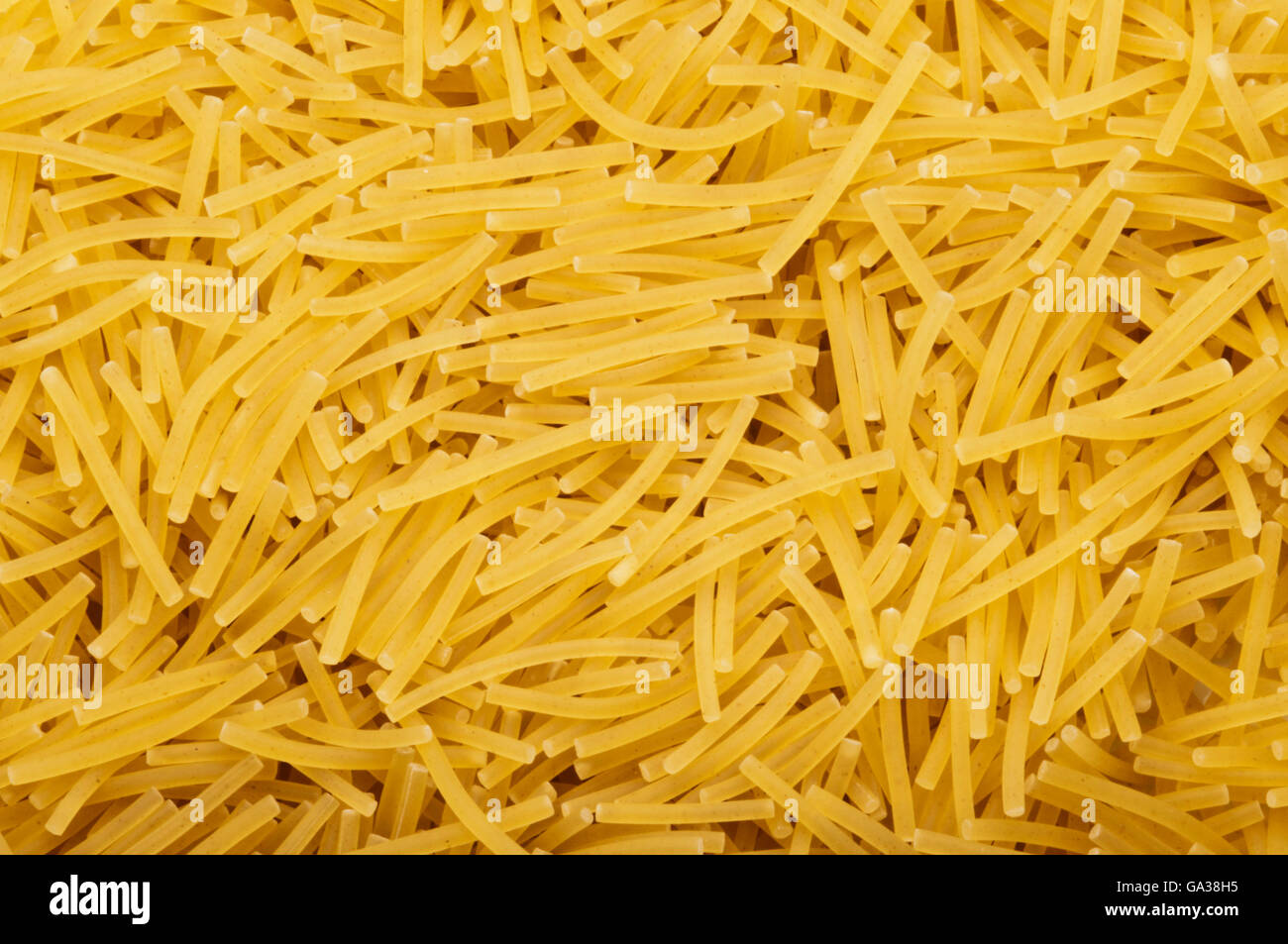 Yellow Raw Macaroni Texture Background Stock Photo - Alamy