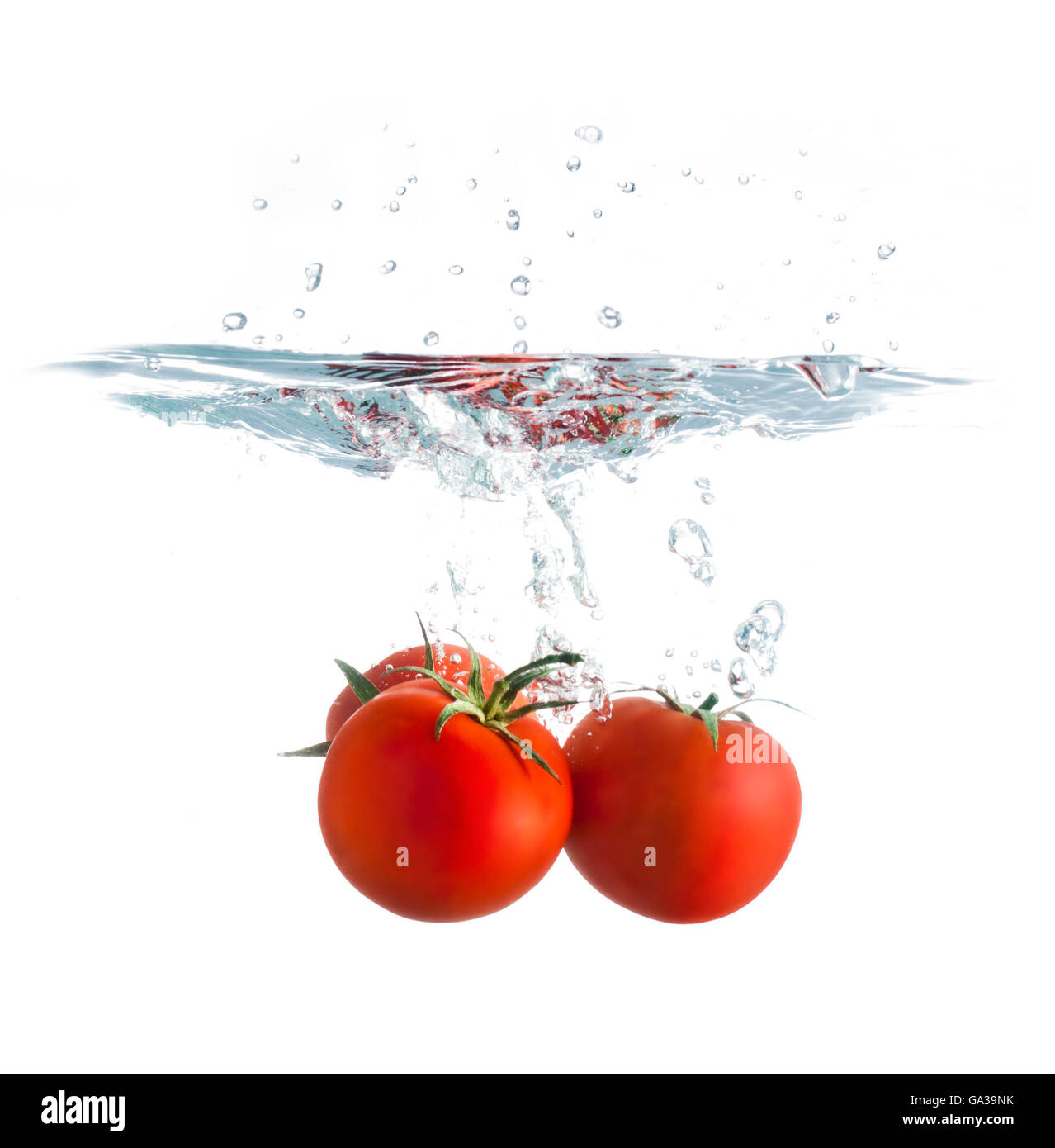 Sinking Tomato Splash Isolated on White Background Stock Photo - Alamy