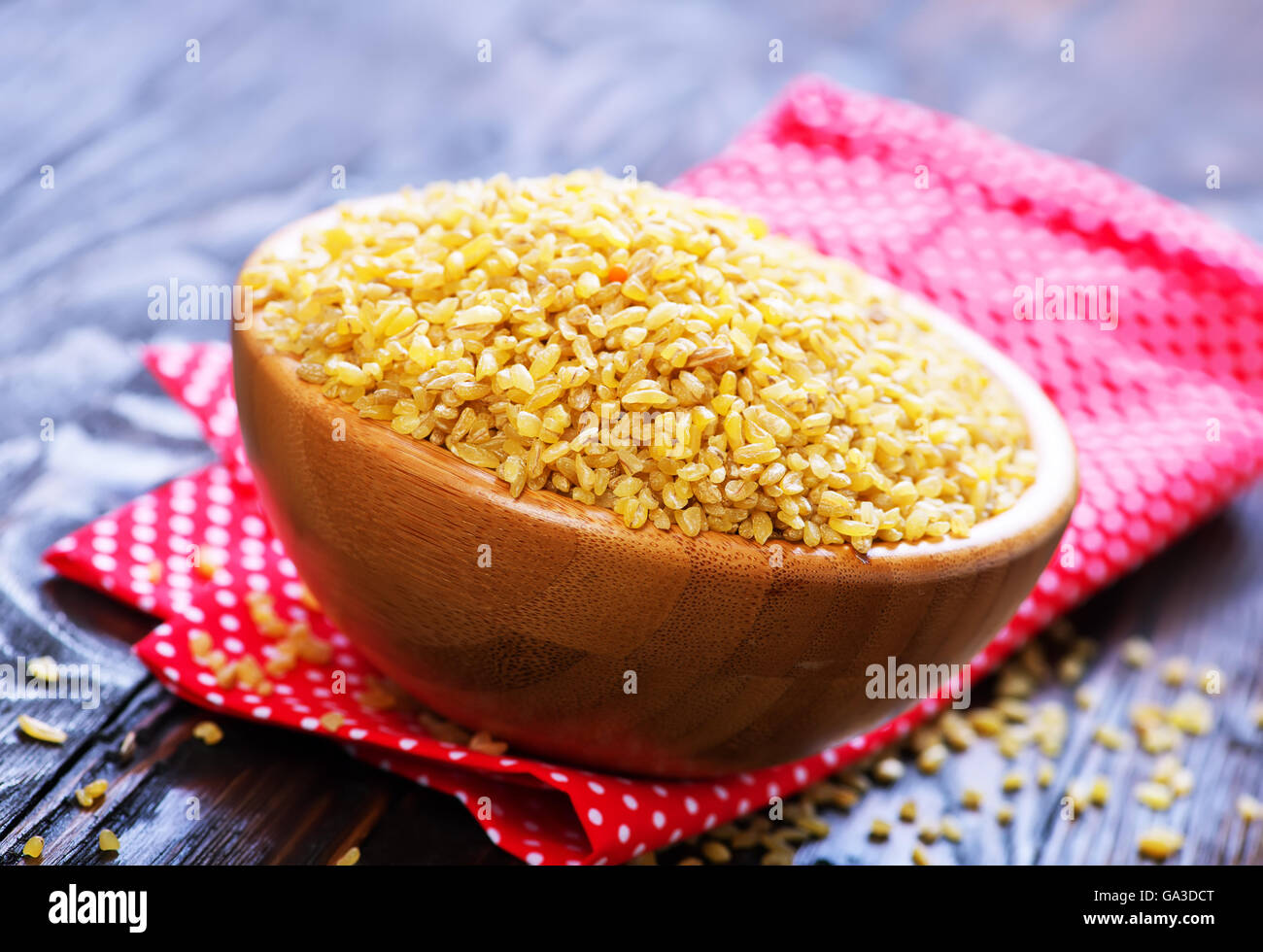 raw bulgur in bowl and on a table Stock Photo - Alamy