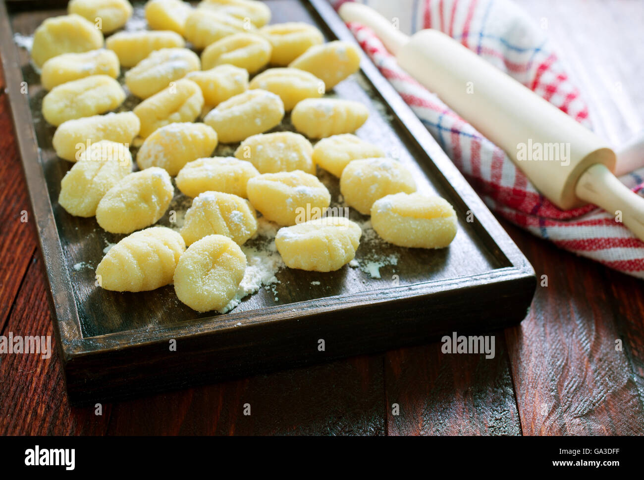 raw potato gnocchi on the wooden table Stock Photo - Alamy