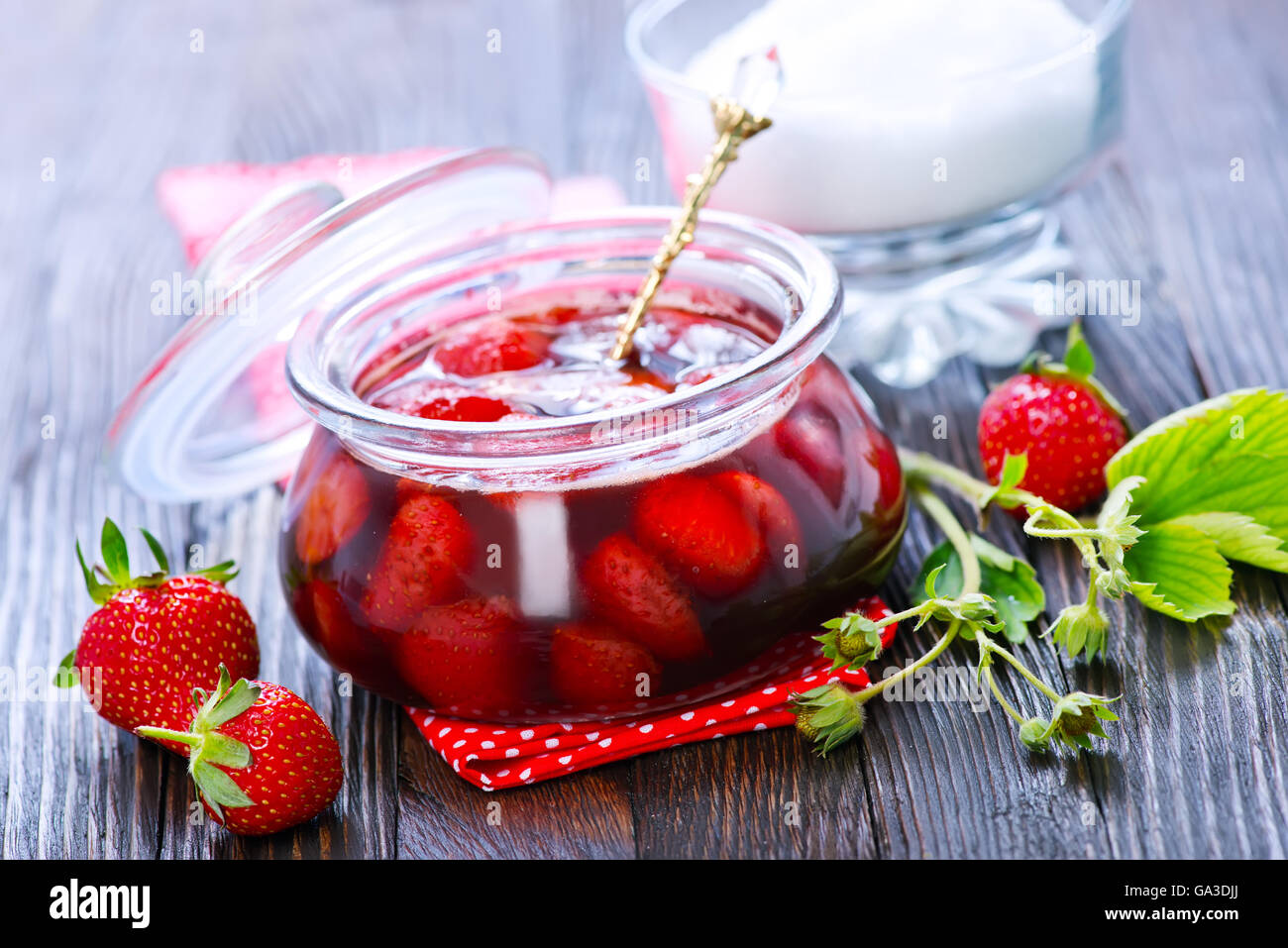 strawberry jam in bank and on a table Stock Photo - Alamy