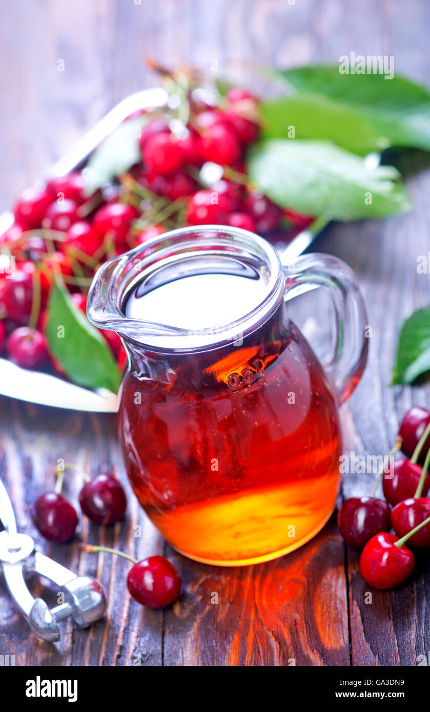 cherry juice in jug and on a table Stock Photo - Alamy