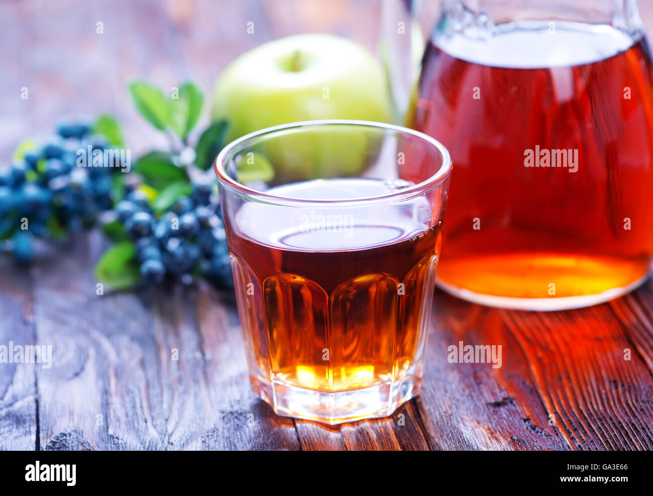 fresh juice in glass and on a table Stock Photo - Alamy