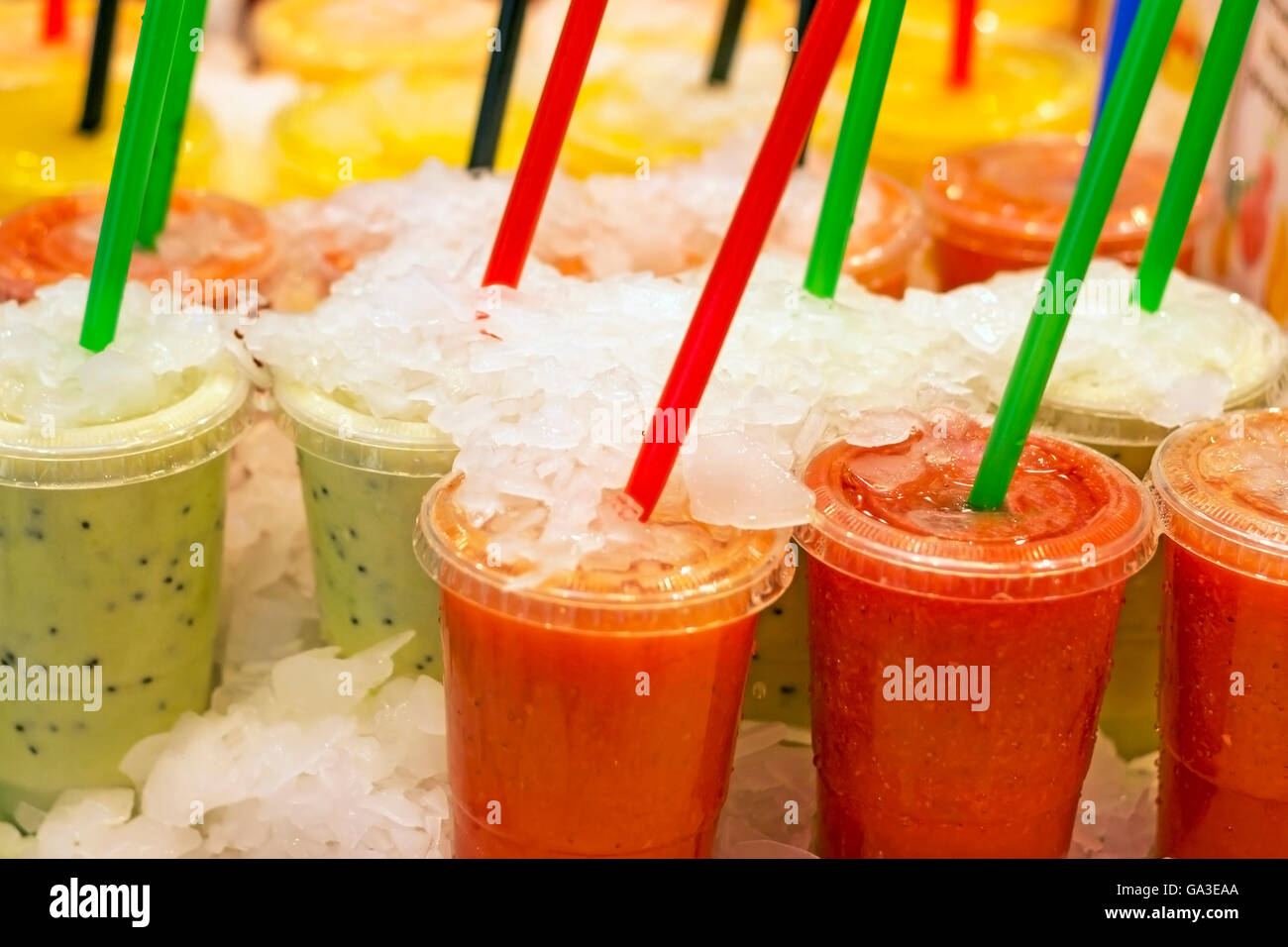 Various cold fruit fresh juices on the market Stock Photo - Alamy