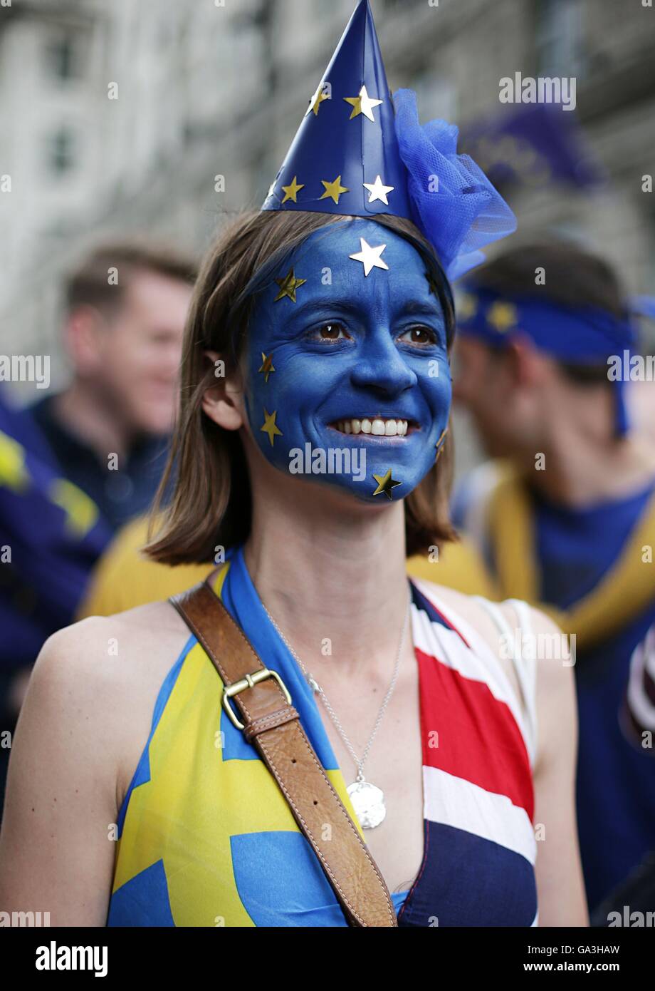 A Remain supporter wearing face paint and European flags takes part in ...