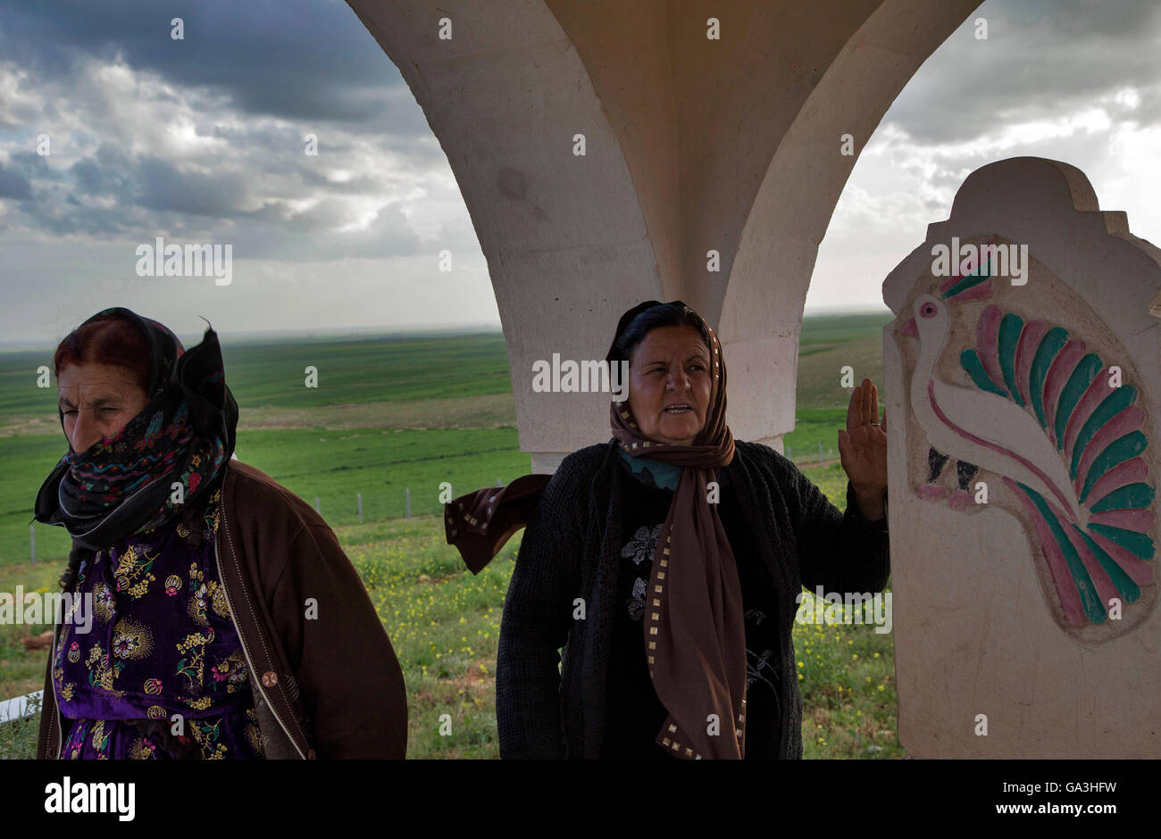 women who weeps in cemetery of Mezra Ezidiye Village.Yazidis are an ...