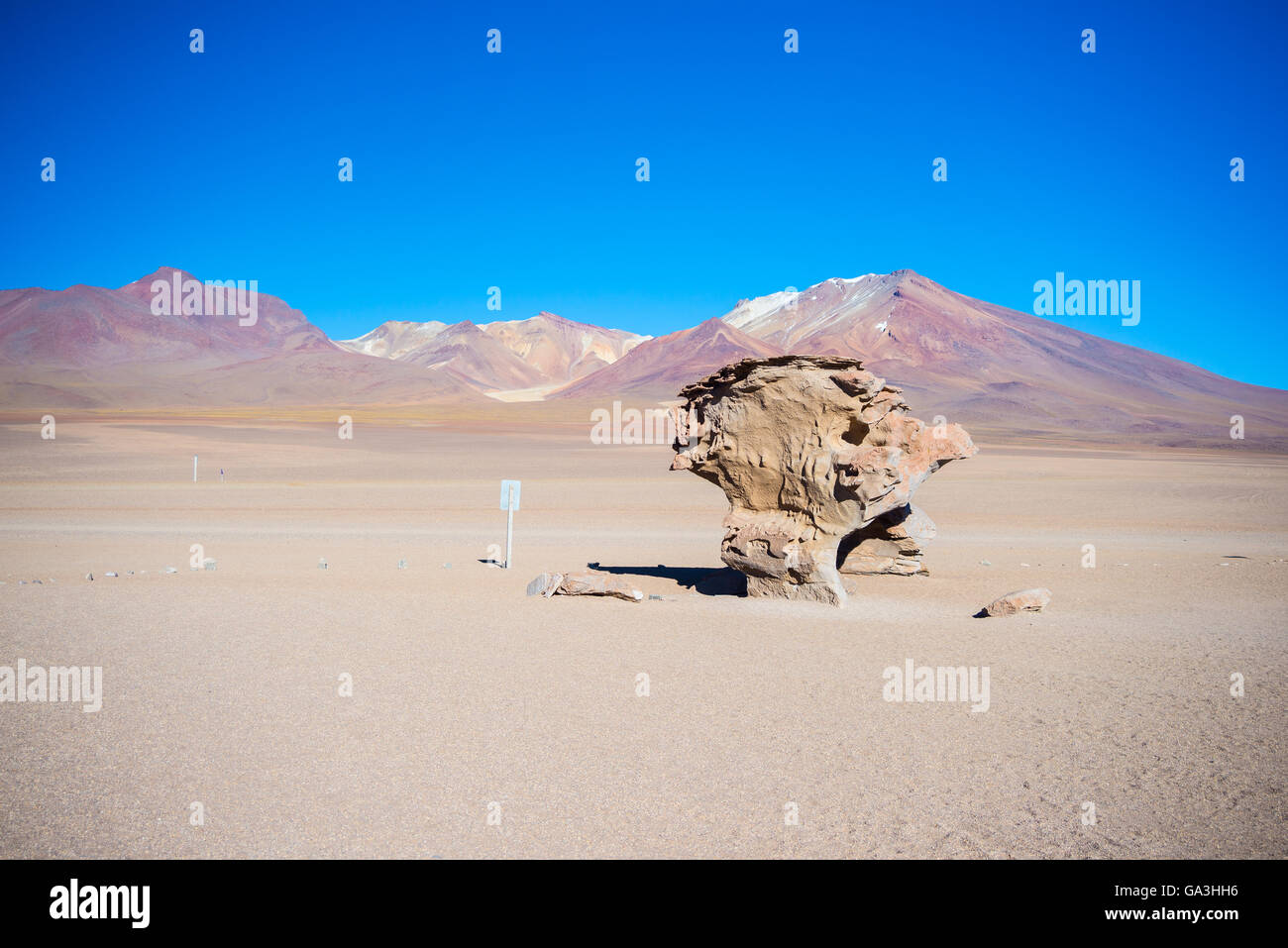 Sandy desert and scenic rock formation, known as "Rock Tree", on the ...
