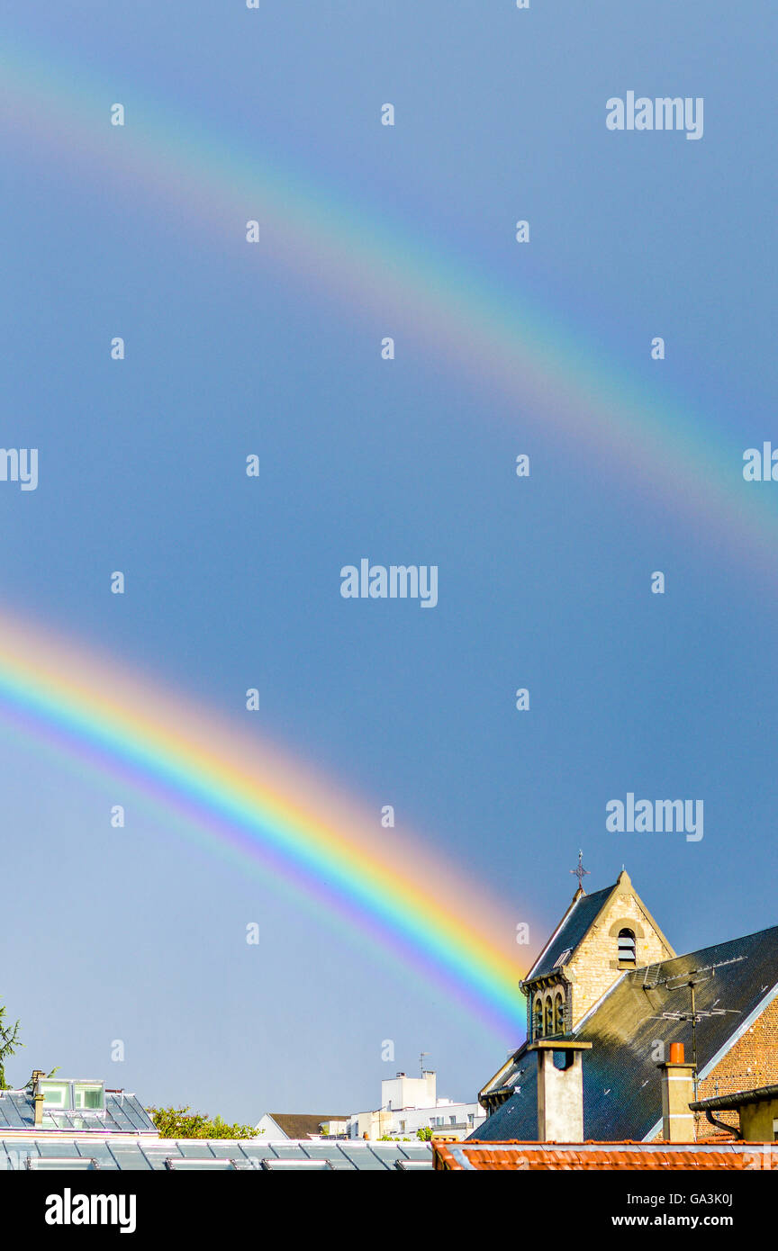 double rainbow over a church roof Stock Photo - Alamy