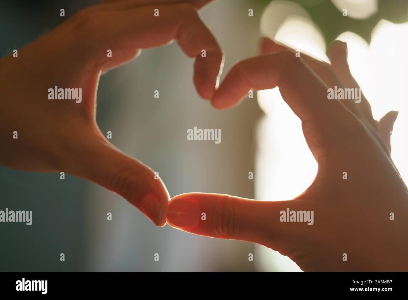Girl making heart hands hi-res stock photography and images - Alamy