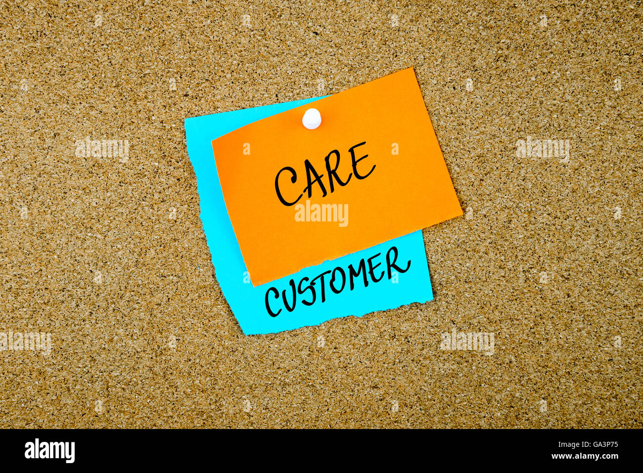 Customer Care written on paper notes pinned on cork board with white ...