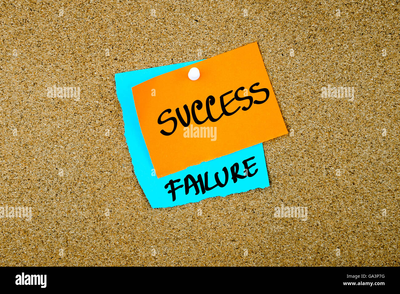 Failure Success written on paper notes pinned on cork board with white ...