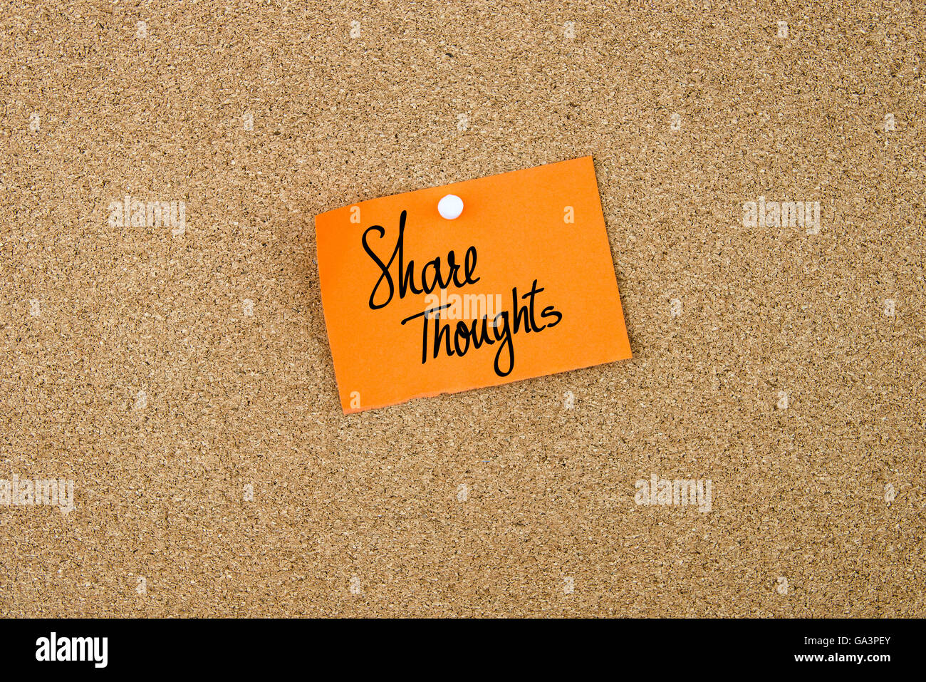 Share Thoughts written on orange paper note note pinned on cork board ...