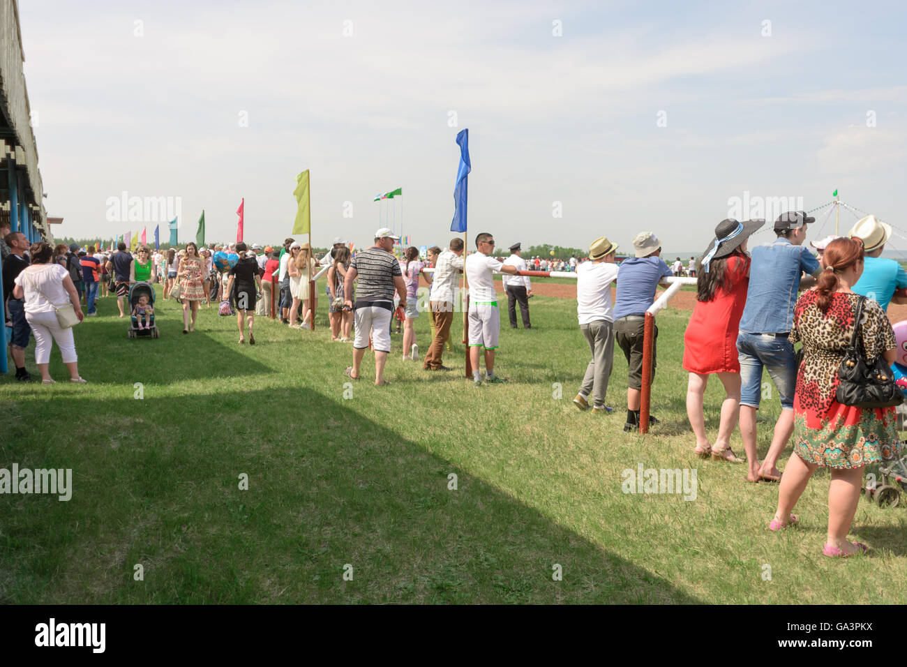 People watching a sporting event horse racing as spectators Stock Photo ...
