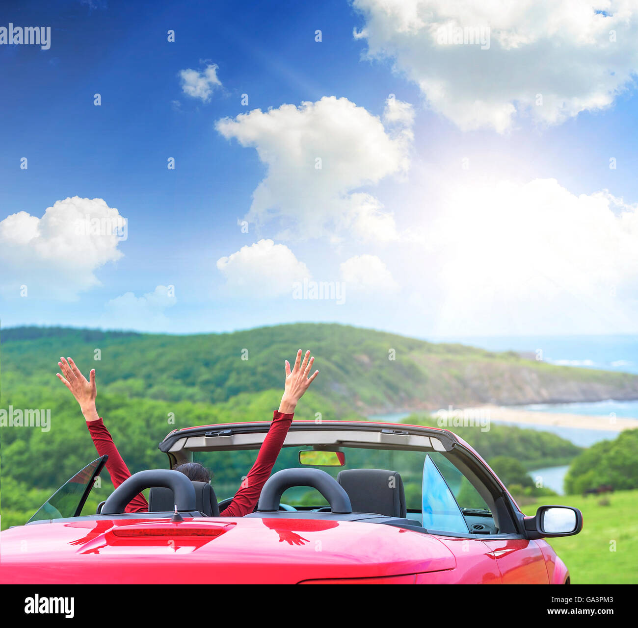 Girl in a red convertible car on a background seascape Stock Photo - Alamy
