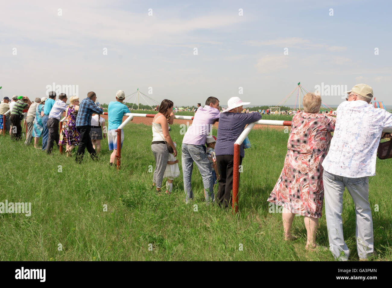 People watching a sporting event horse racing as spectators Stock Photo ...