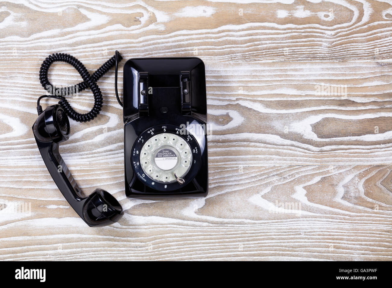 Overhead view of old rotary phone on white fading boards Stock Photo ...