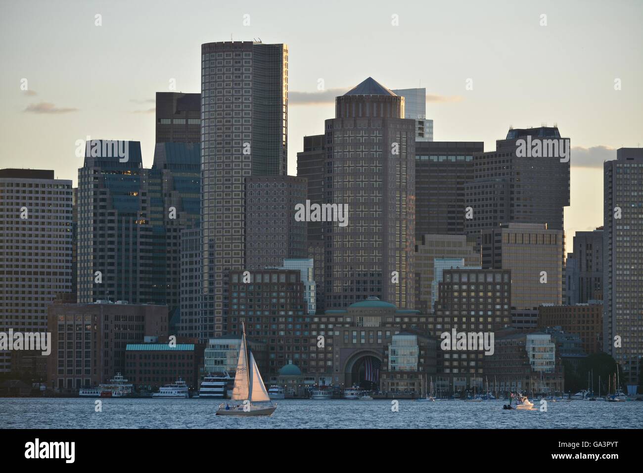 The Boston Skyline seen from the Boston harbor with sail boats and ...