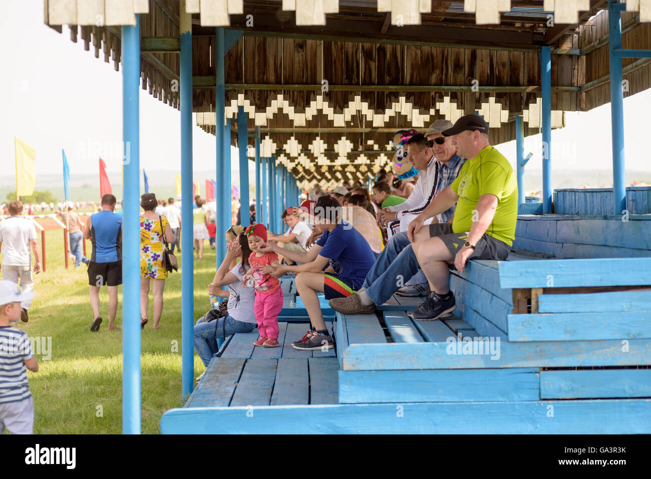 People watching a horse race event Stock Photo - Alamy