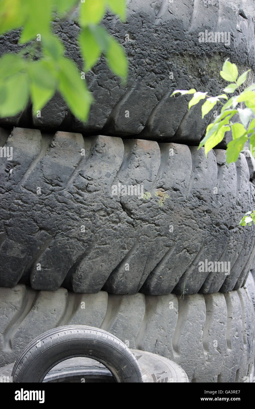 dumping of tires on the wheels in the open air. environmental problem ...