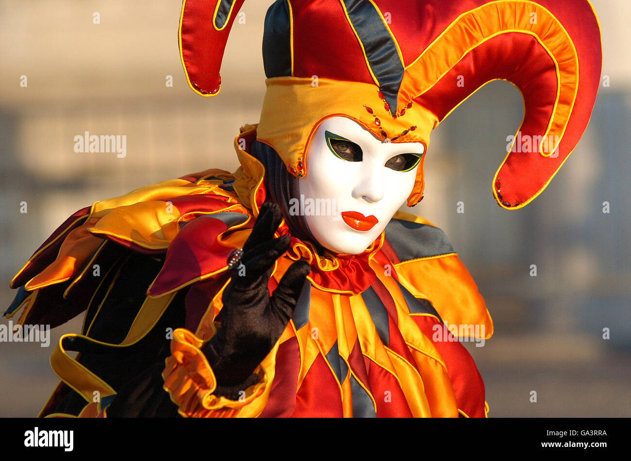 Masketeers in lavish decorative jester costume at the Venice Mask ...
