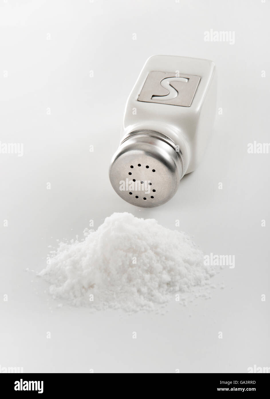 Food Salt Shaker and Pile on White Background Stock Photo - Alamy