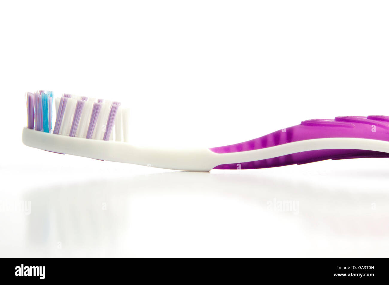 A Purple Toothbrush Isolated on White Background Stock Photo - Alamy