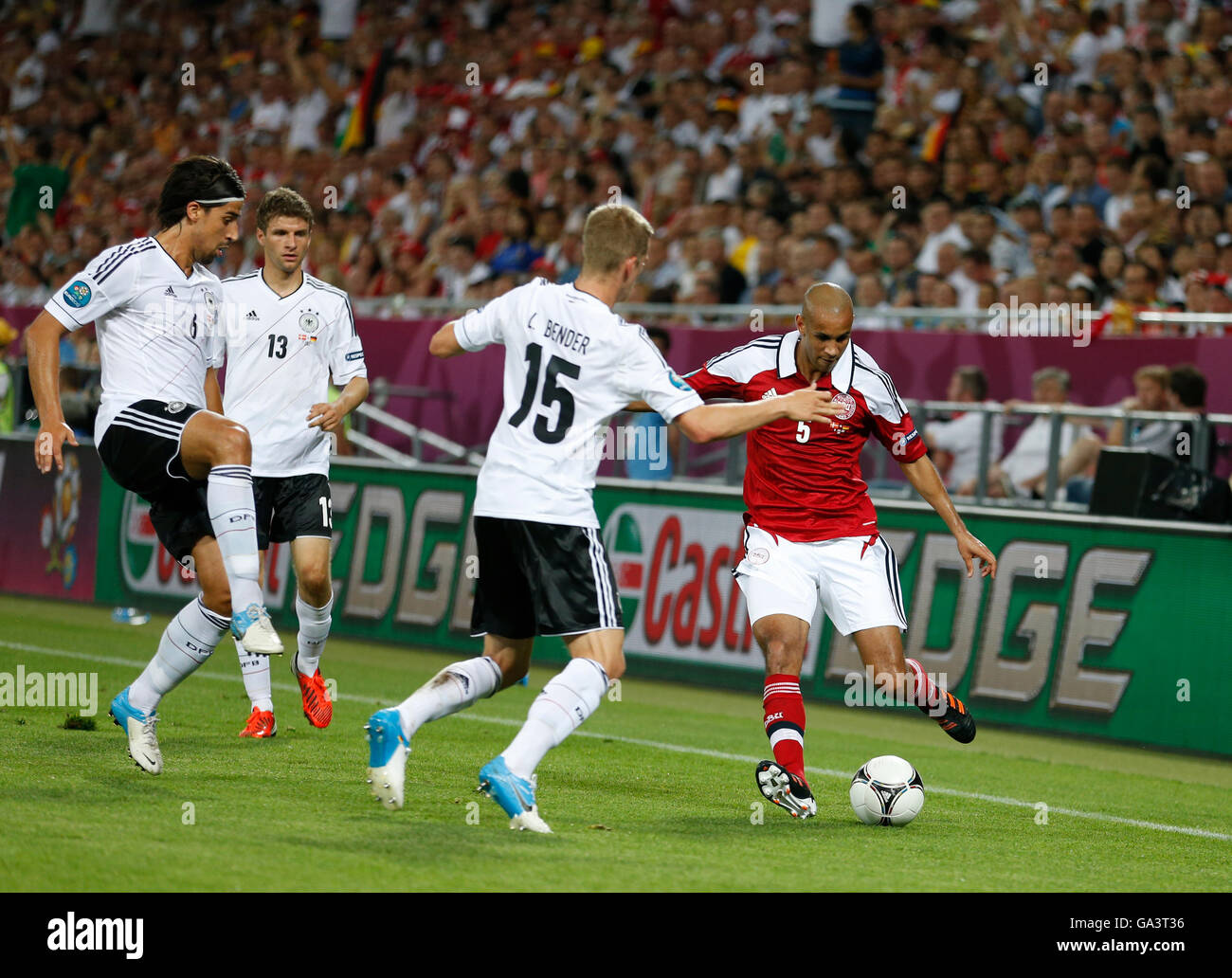 Simon Poulsen of Denmark (R) fights for a ball with Germany players ...