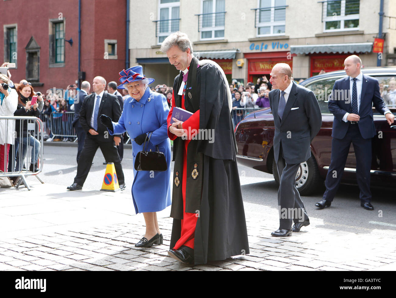 Queen Elizabeth II is greeted by Reverend Neil Gardner, as she arrives ...