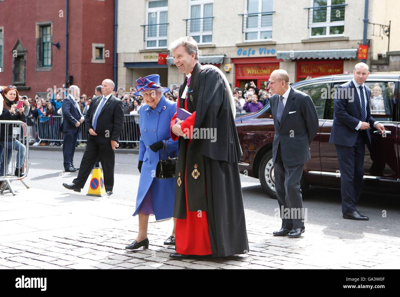 Queen Elizabeth II is greeted by Reverend Neil Gardner, as she arrives ...